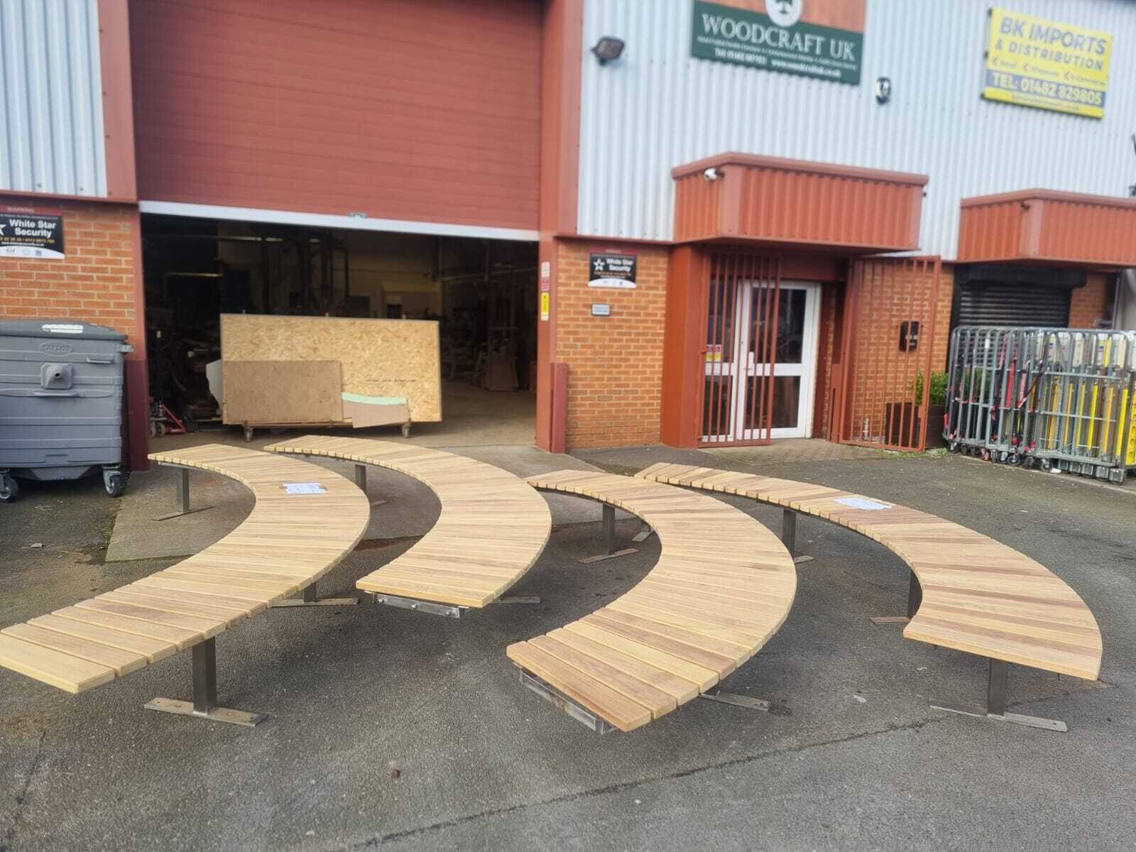 Two curved benches in stainless steel and hardwood for NHS site ...
